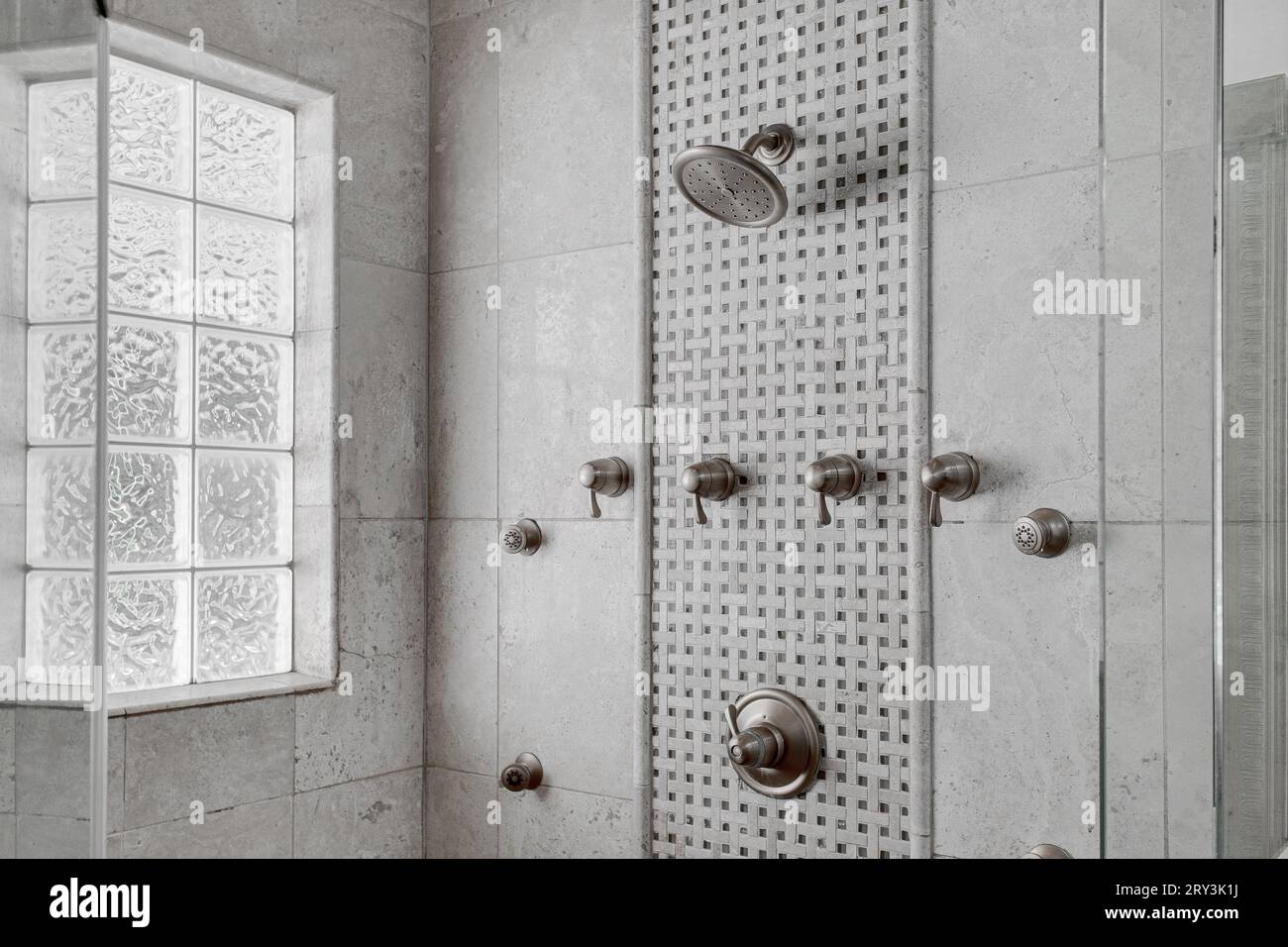 Traditional Interior of Primary Bathroom Shower with Stone Walls and ...