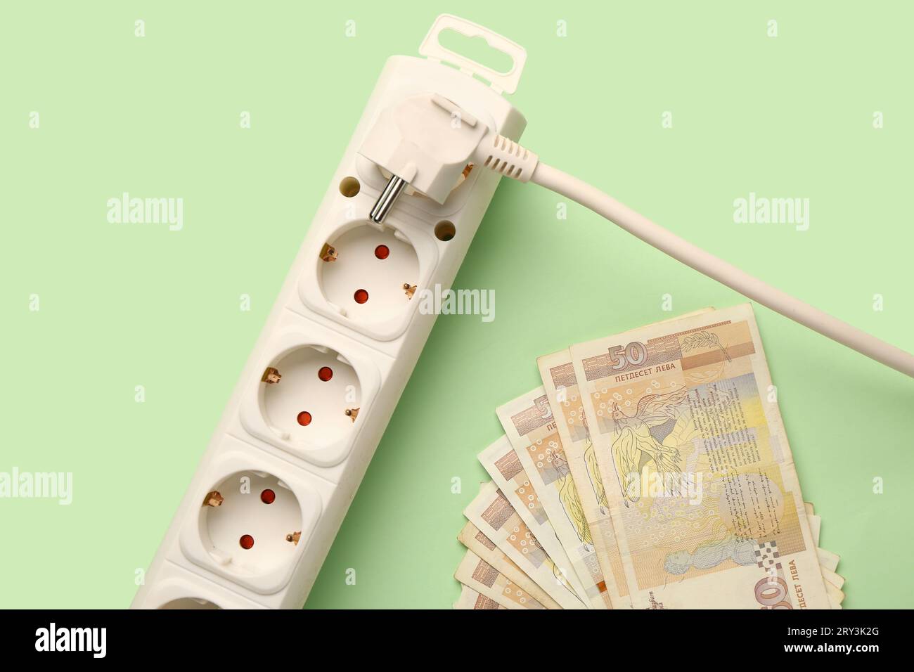 Bulgarian lev banknotes with plug and power socket on green background ...