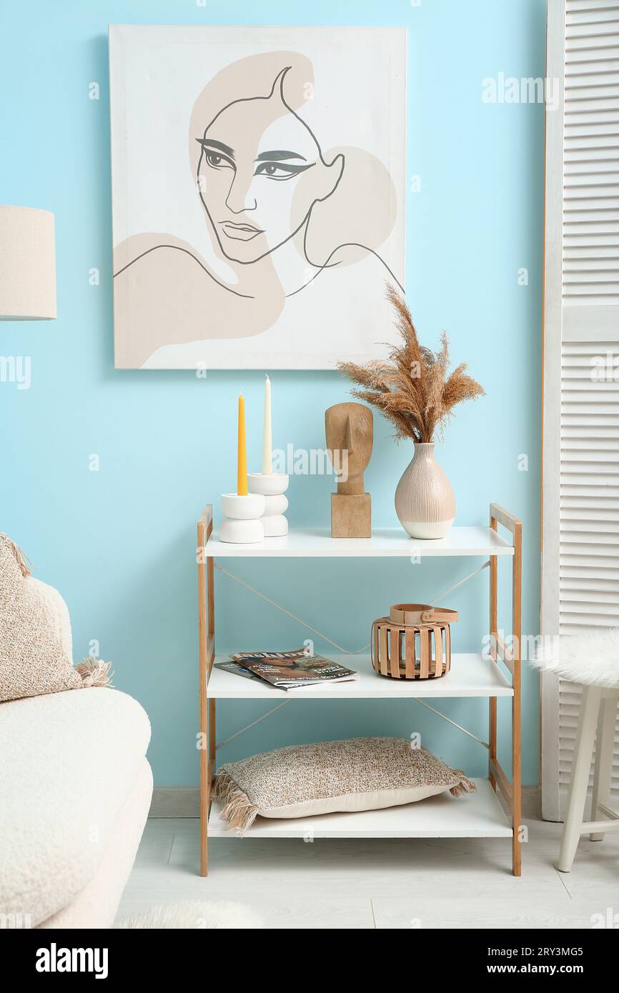 Modern living room interior with shelving unit and poster Stock Photo ...