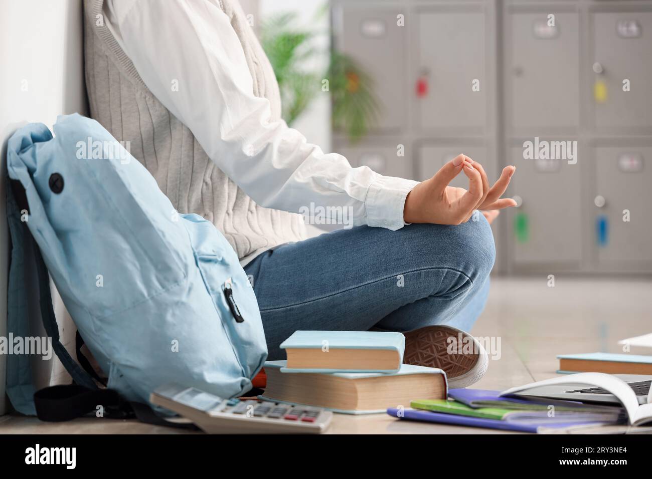 Female student meditating at university hall, closeup Stock Photo - Alamy