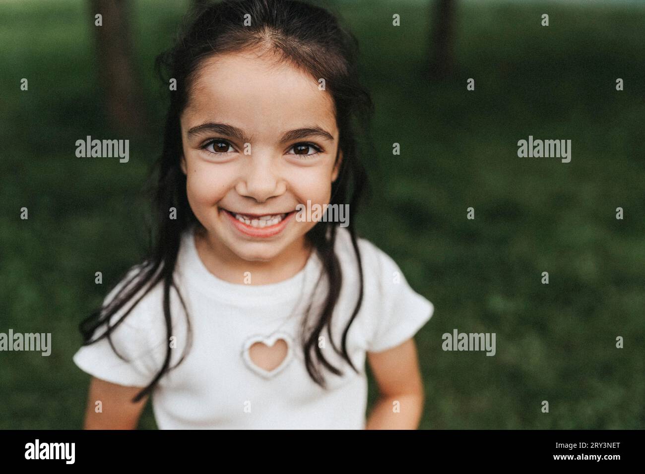Portrait happy girl standing outdoors hi-res stock photography and ...