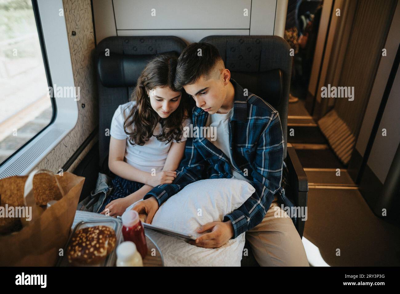 Brother sister on train in hi-res stock photography and images - Alamy