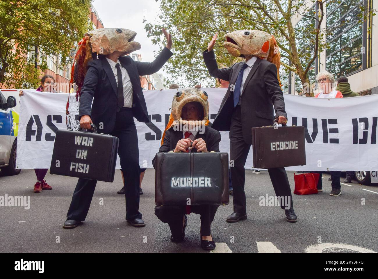 London, UK. 28th Sep, 2023. Activists wearing fish masks and suits and ...