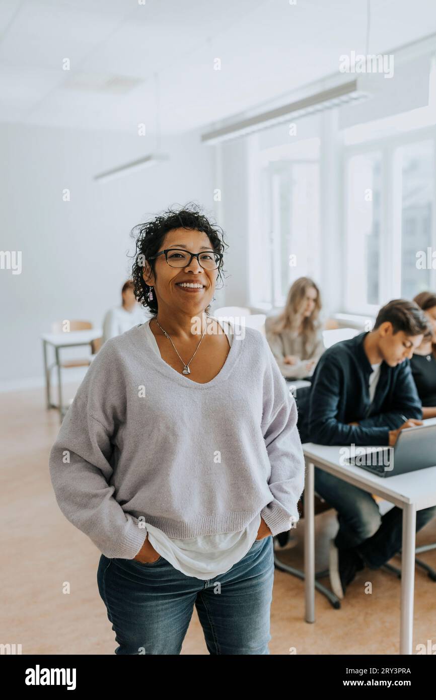 Mature female professor standing college hi-res stock photography and ...