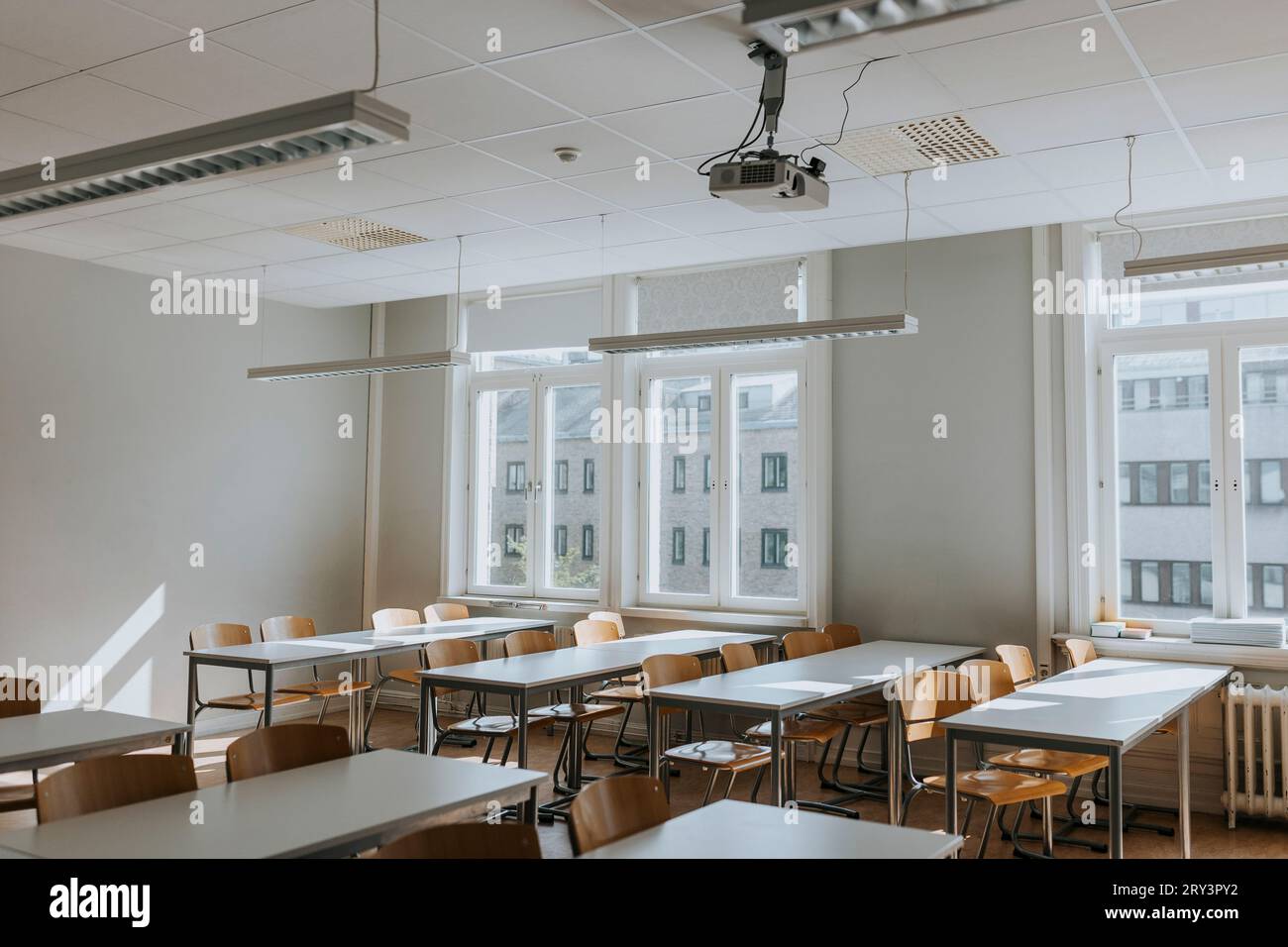 Empty chairs and desks in classroom at school Stock Photo - Alamy