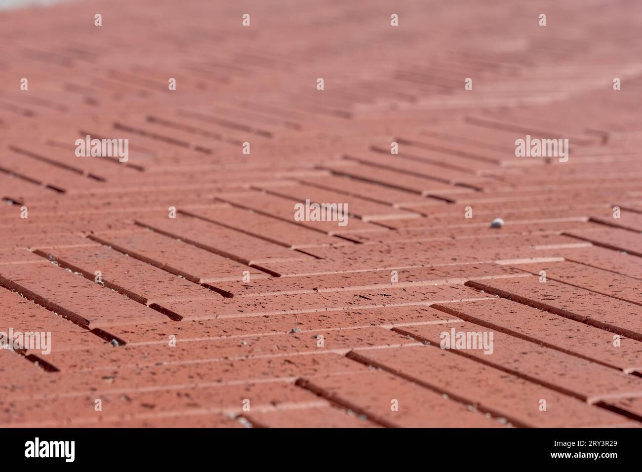 Sidewalk pavement in rust color, herringbone terracota pattern in ...