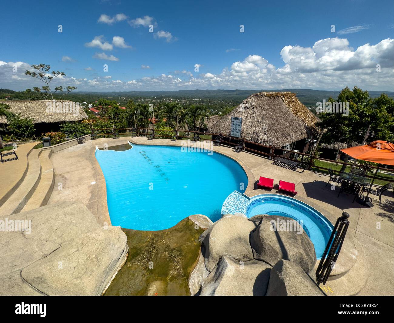 The blue-tiled swimming pool at the Cahal Pech Village Resort in San ...
