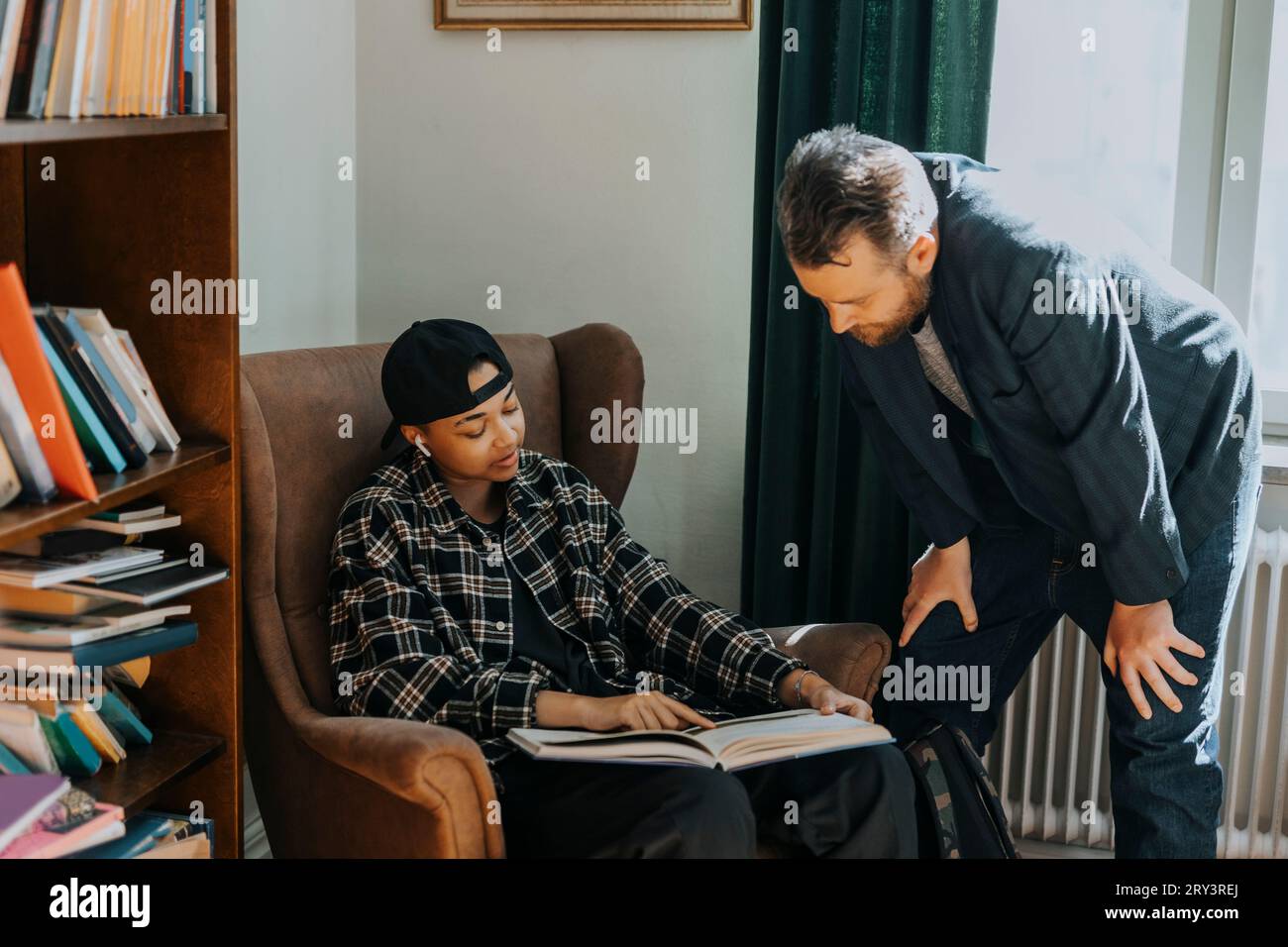 Young male teacher student hi-res stock photography and images - Alamy