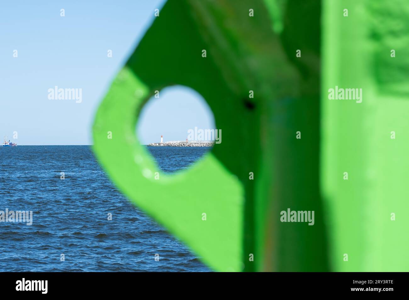 A durable green metal structure with a part like round hole through ...