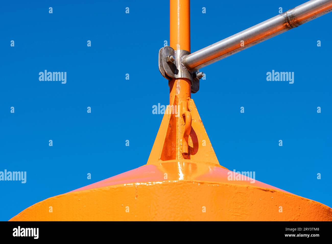 Orange metal construction with metal tube attachment. Maritime ...