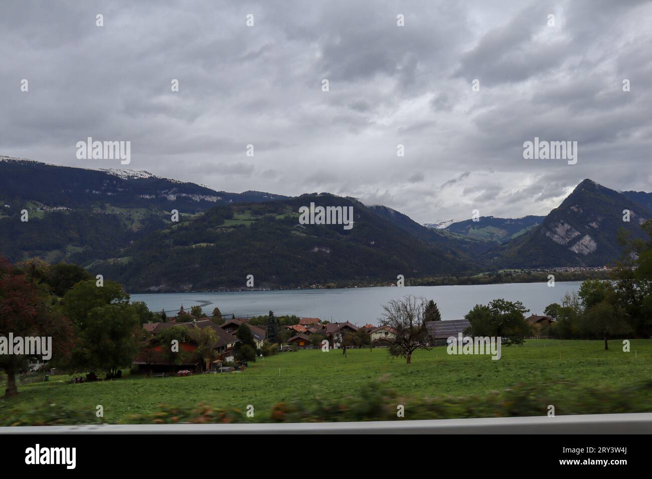 View of mountain and village with cloudy sky, Bern, Switzerland.. Image ...