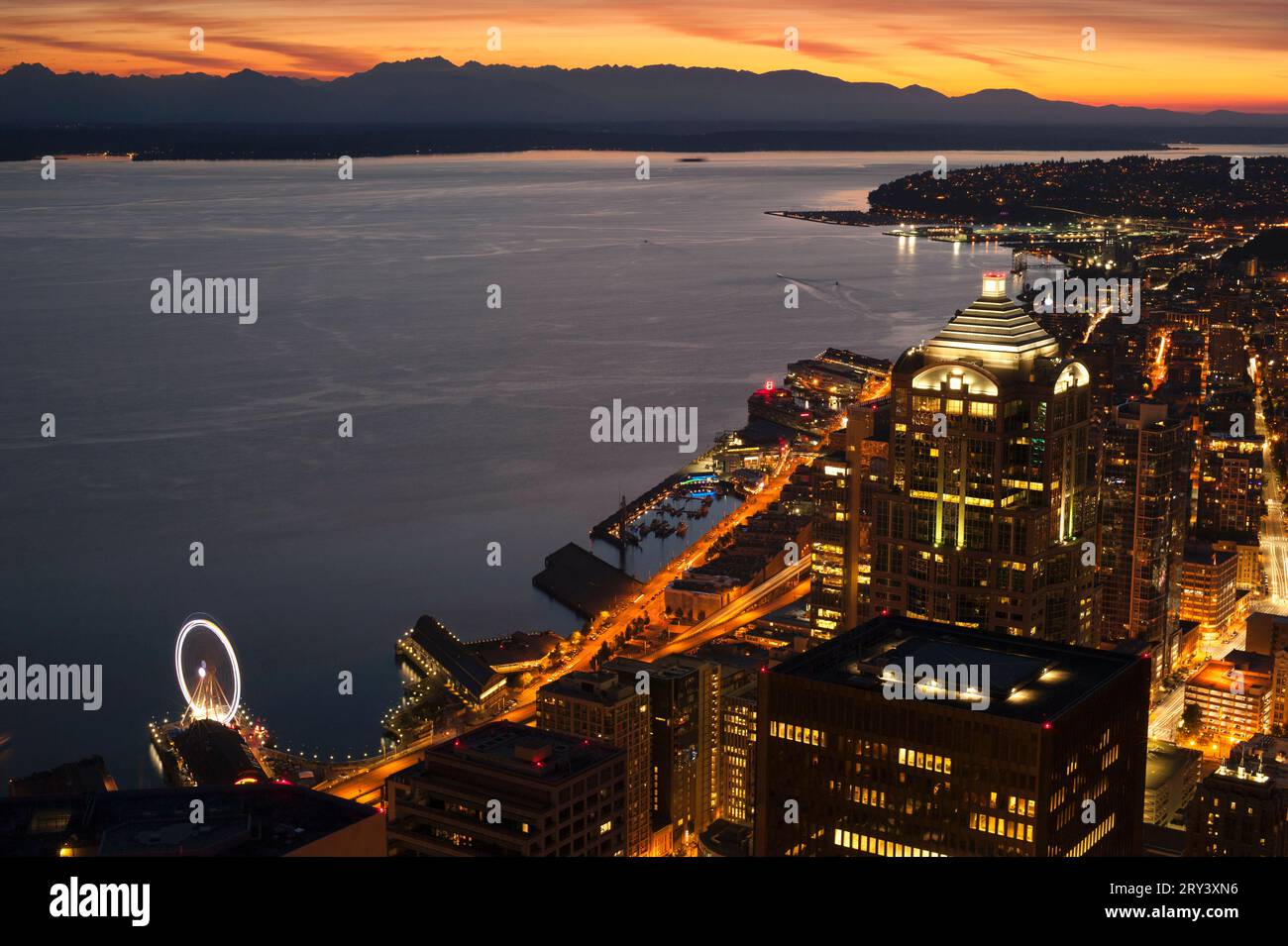 Seattle skyline with Puget Sound and city lights downtown corridor ...