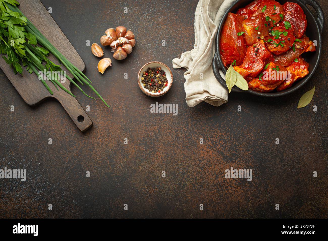 Cooking meat stew. Raw uncooked chopped pieces of meat marinated with ...