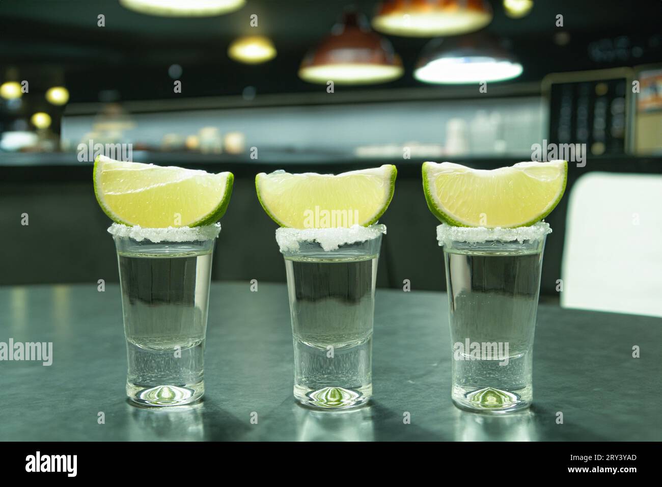 A shot of tequila with salt and lime. Tequila on the background of a ...