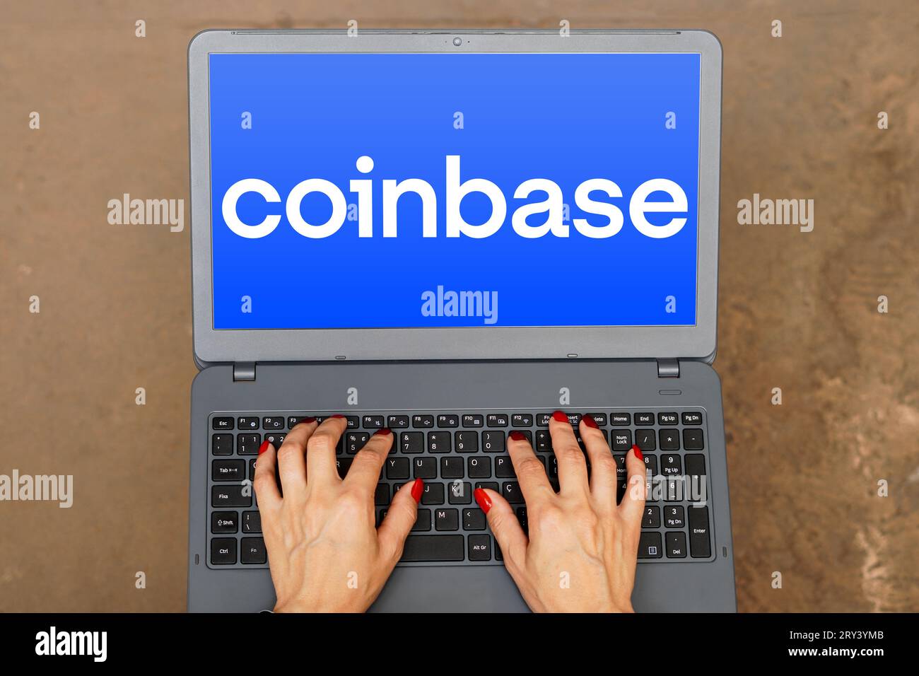 In this photo illustration, the Coinbase logo is displayed on a laptop ...