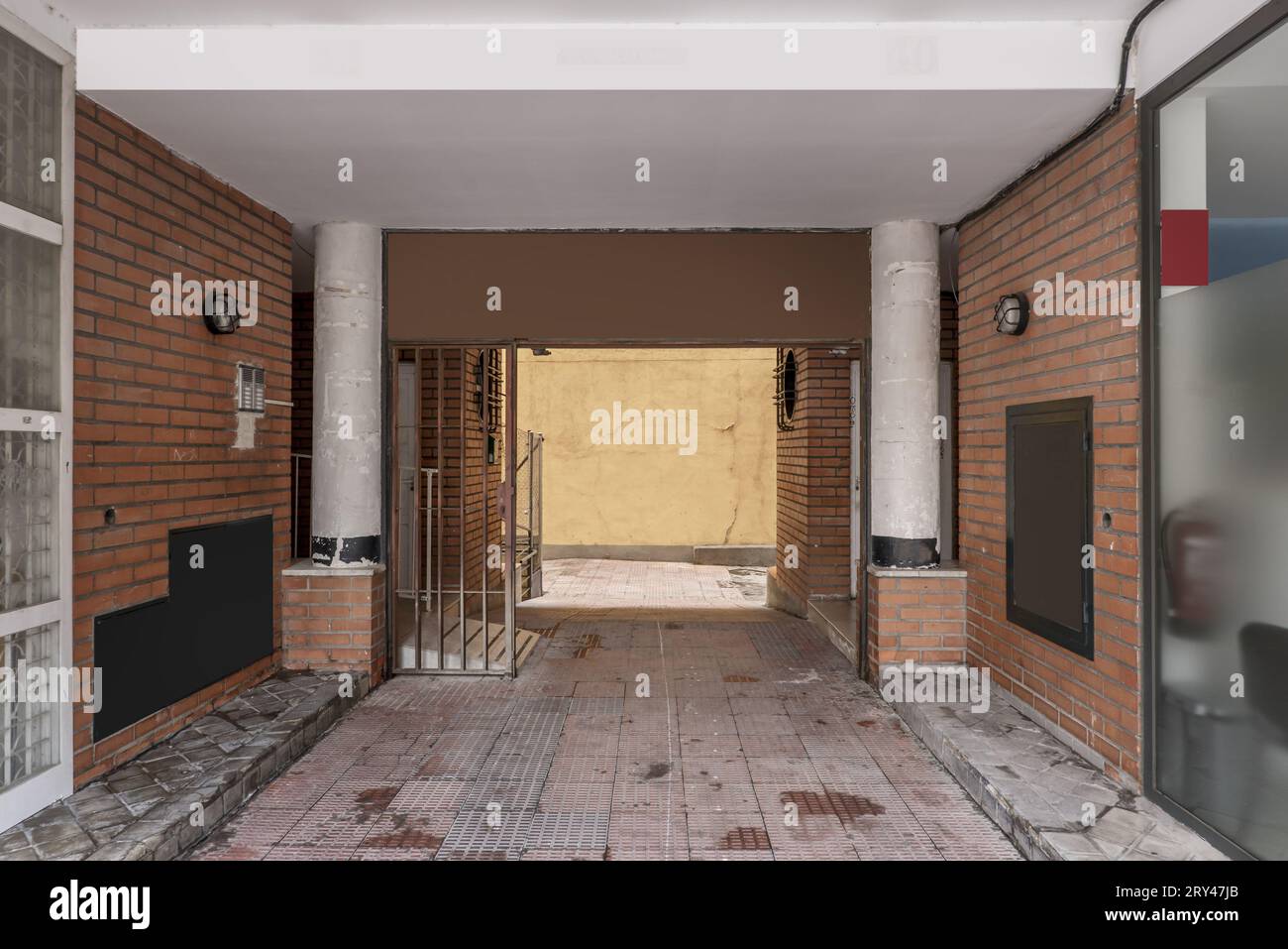 Entrance portal to a building with a passageway and carriage access ...