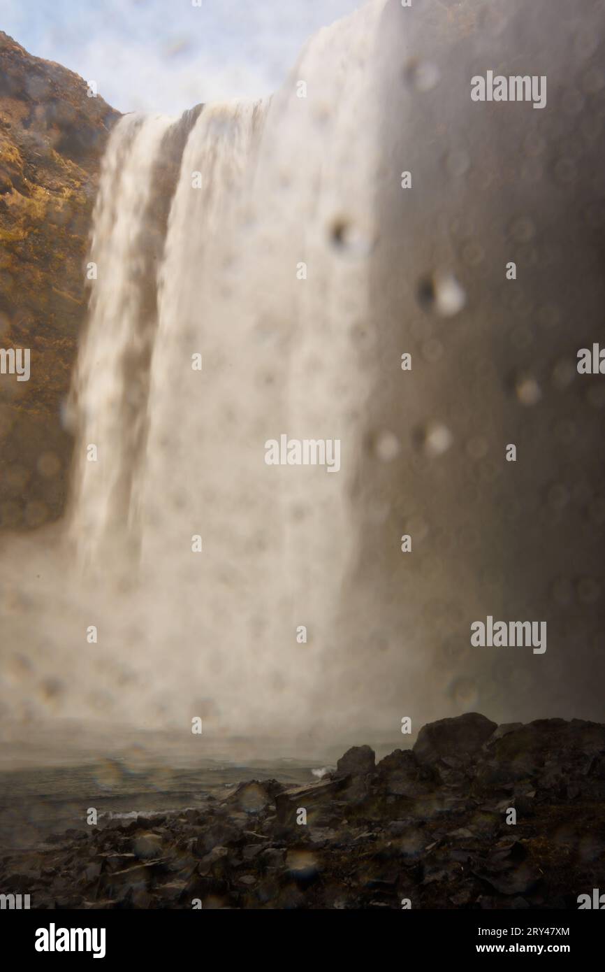 Selective focus of big waterfall in iceland, water stream running down ...