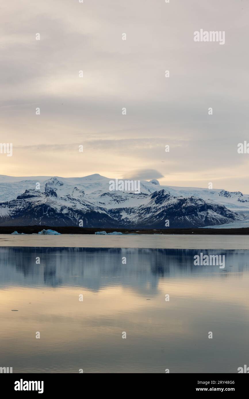 Ice covered hillsides and large scandinavian lake in arctic region of ...