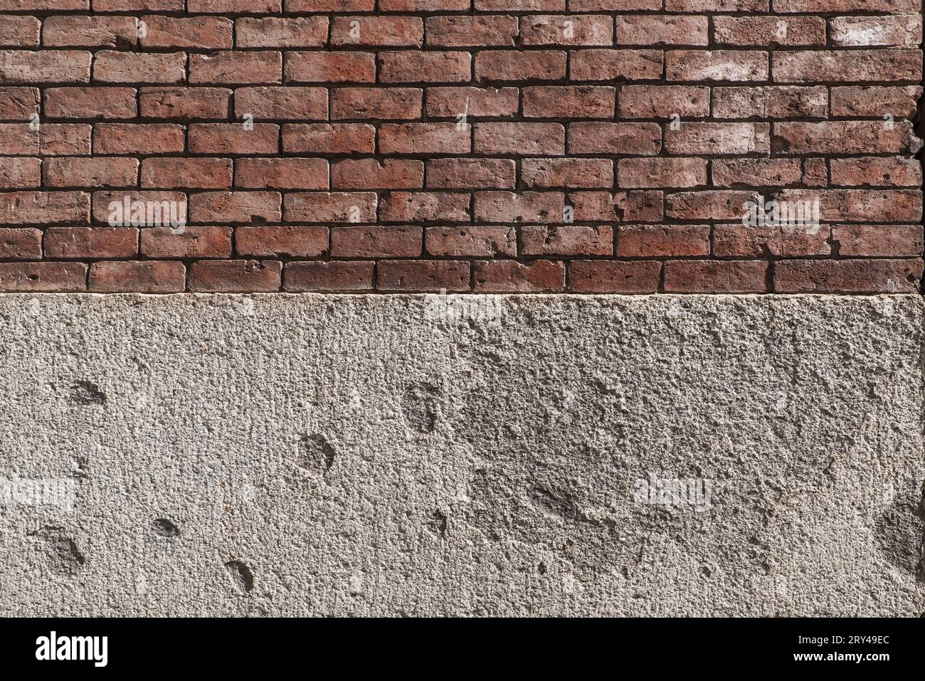 A mixed material wall with exposed clay bricks Stock Photo - Alamy