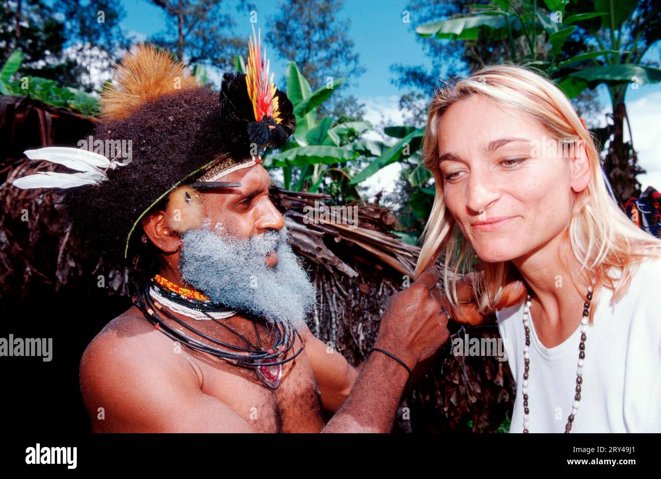 Huli man with tourist, Tari, Papua New-Guinea, Huli man and tourist ...