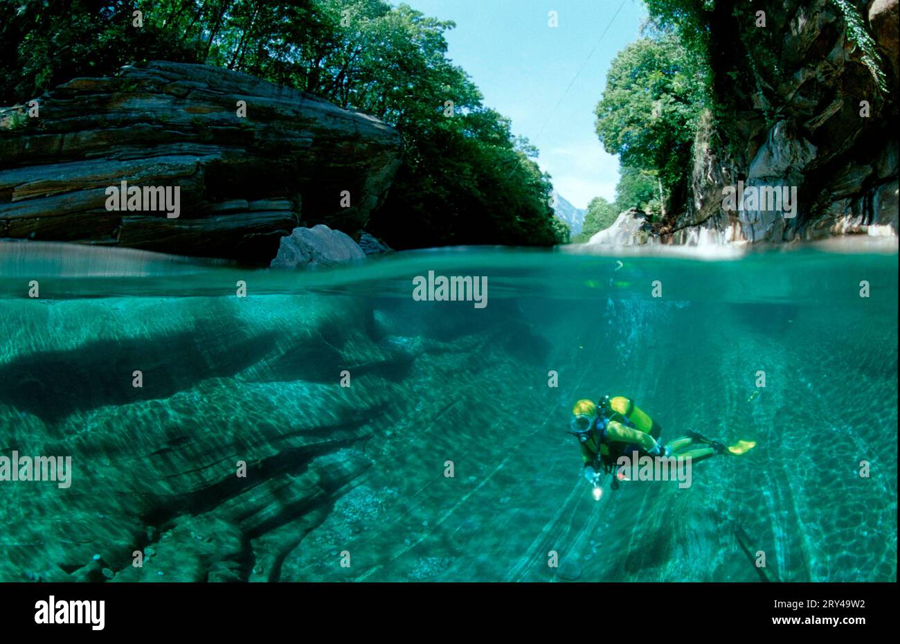 Diver in river, Switzerland, diver in river, Verzasca Valley, under ...