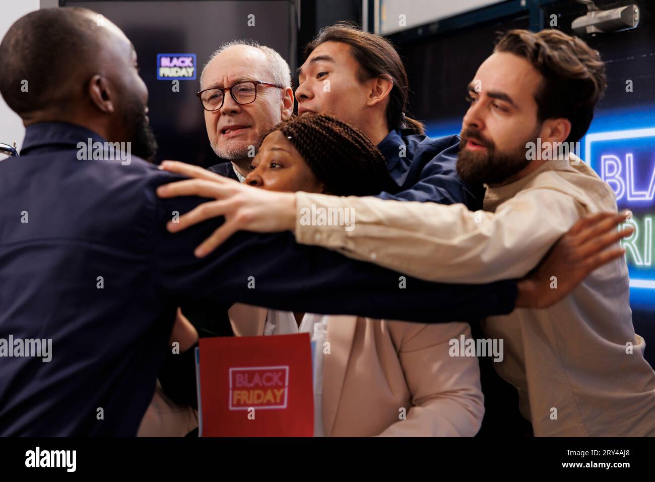 Black Friday madness. African American security guard holding back ...