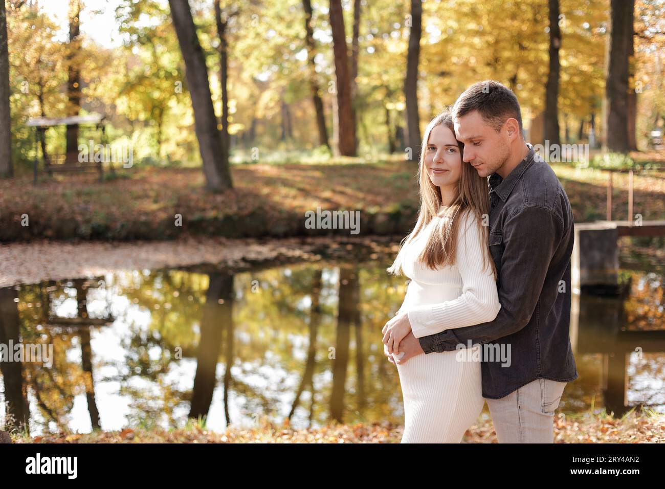 Family day. Stylish marriage pregnant couple waiting for baby. Man is ...