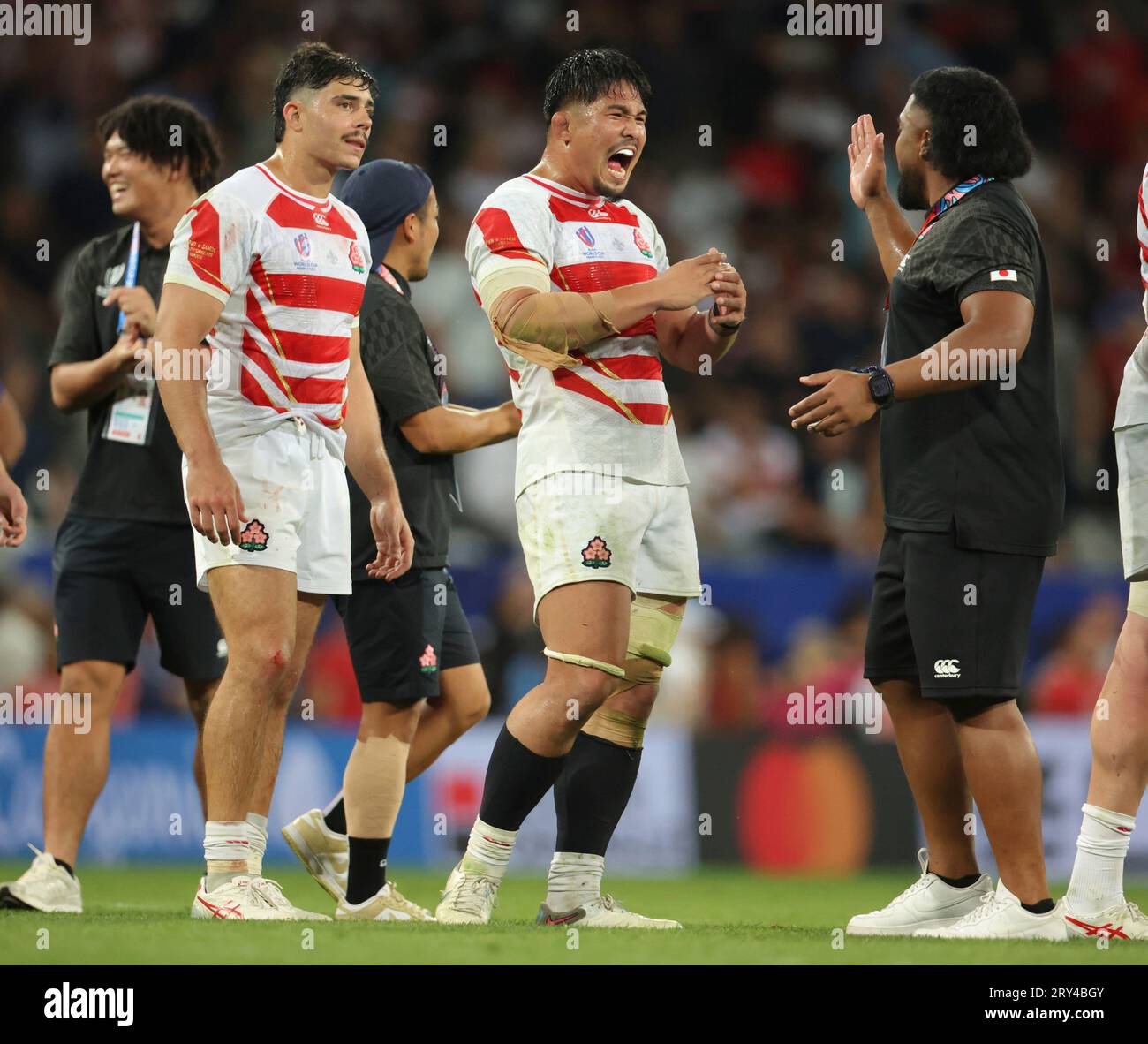Japan's players celebrate after winning the Rugby World Cup Pool D ...