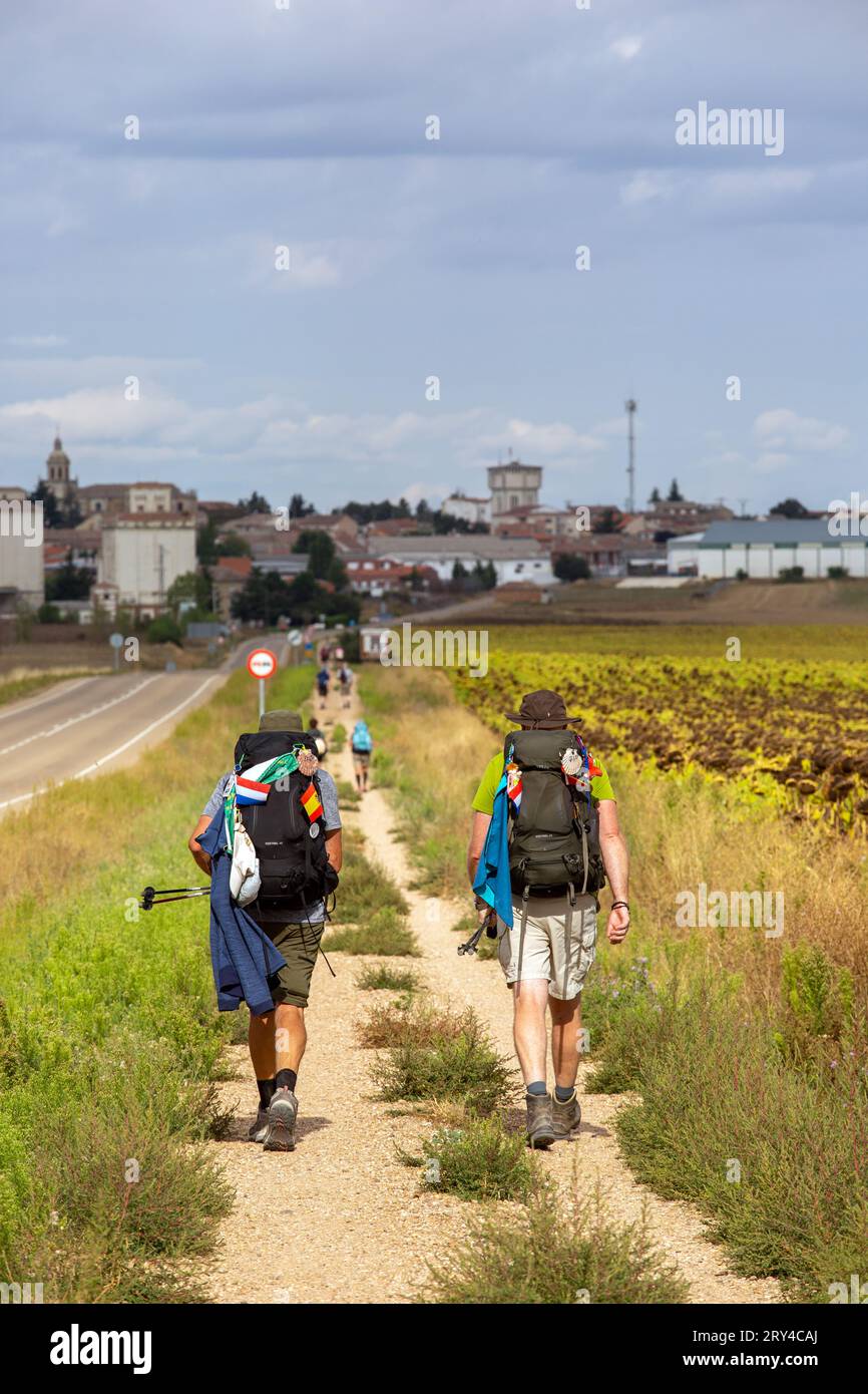 Pilgrims walking the Camino de Santiago pilgrimage route, the way of St ...