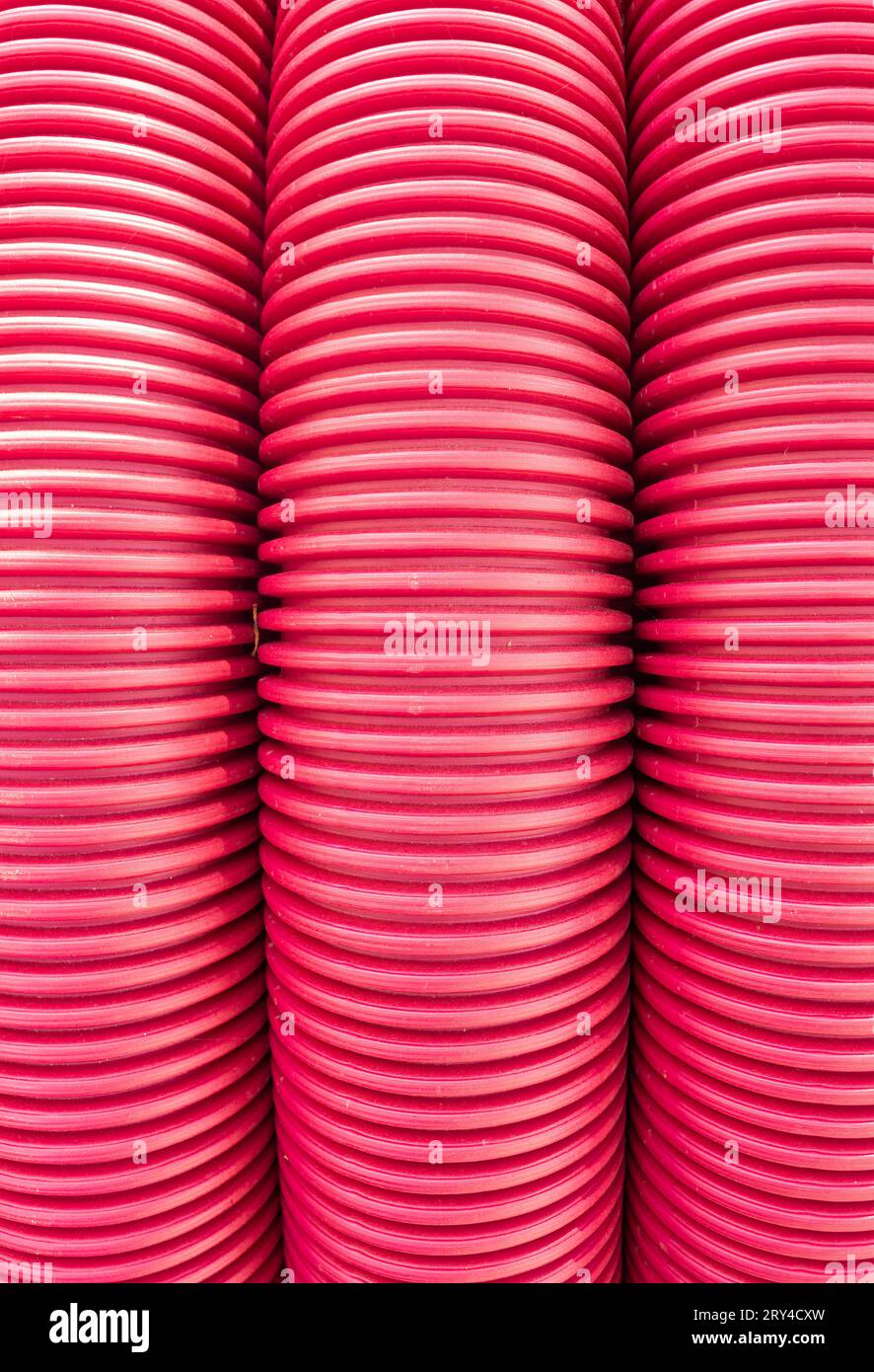 Background from detail of red plastic insulating pipes Stock Photo - Alamy