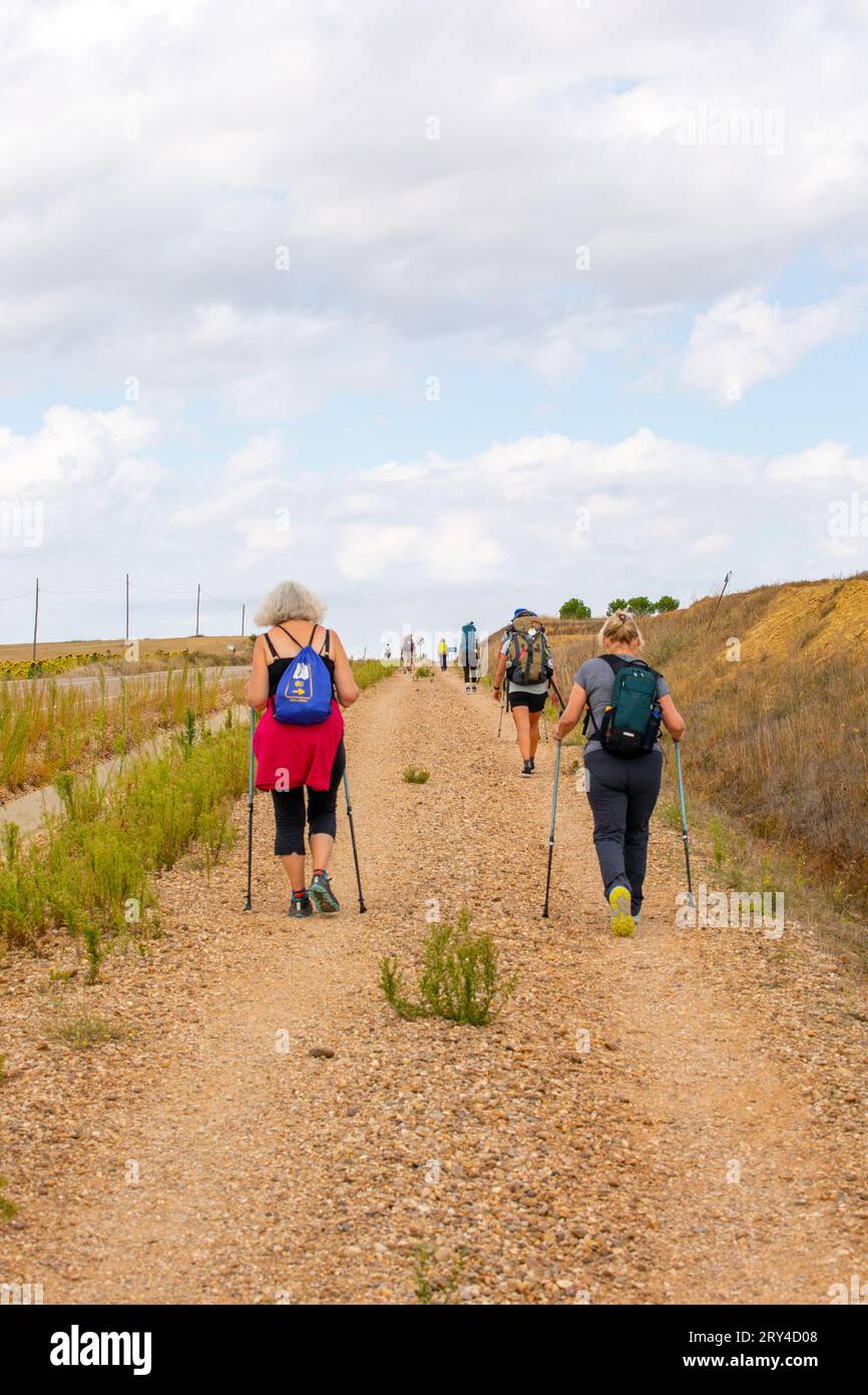 Pilgrims walking the Camino de Santiago pilgrimage route, the way of St ...