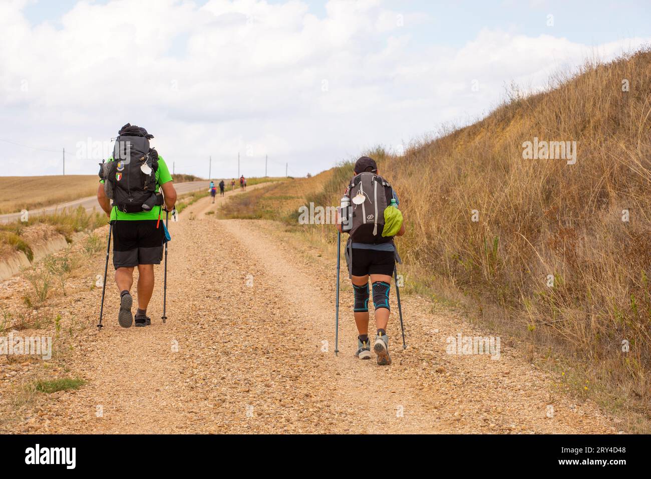 Pilgrims walking the Camino de Santiago pilgrimage route, the way of St ...