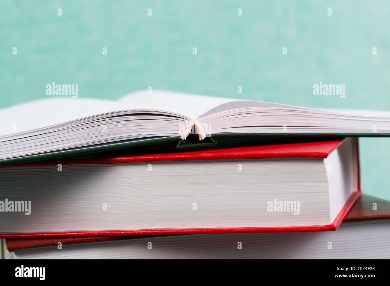 Open book, stack of hardback books. Back to school Stock Photo - Alamy