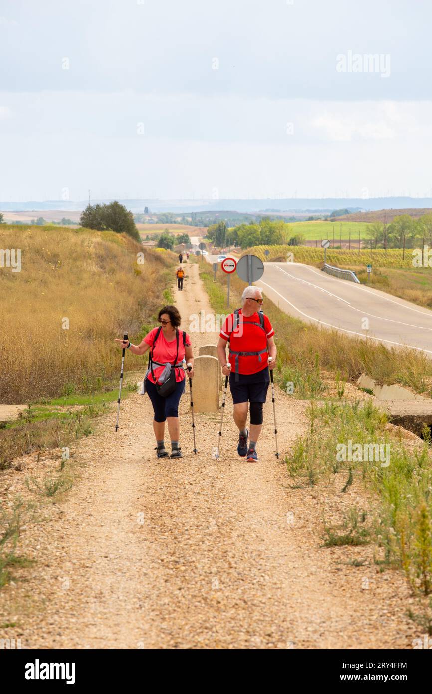 Pilgrims walking the Camino de Santiago pilgrimage route, the way of St ...