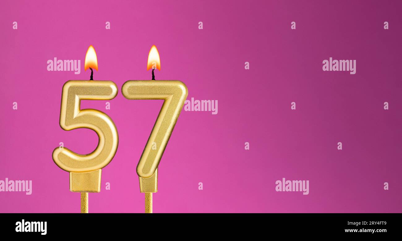 Candle number 57 in purple background - birthday card Stock Photo - Alamy