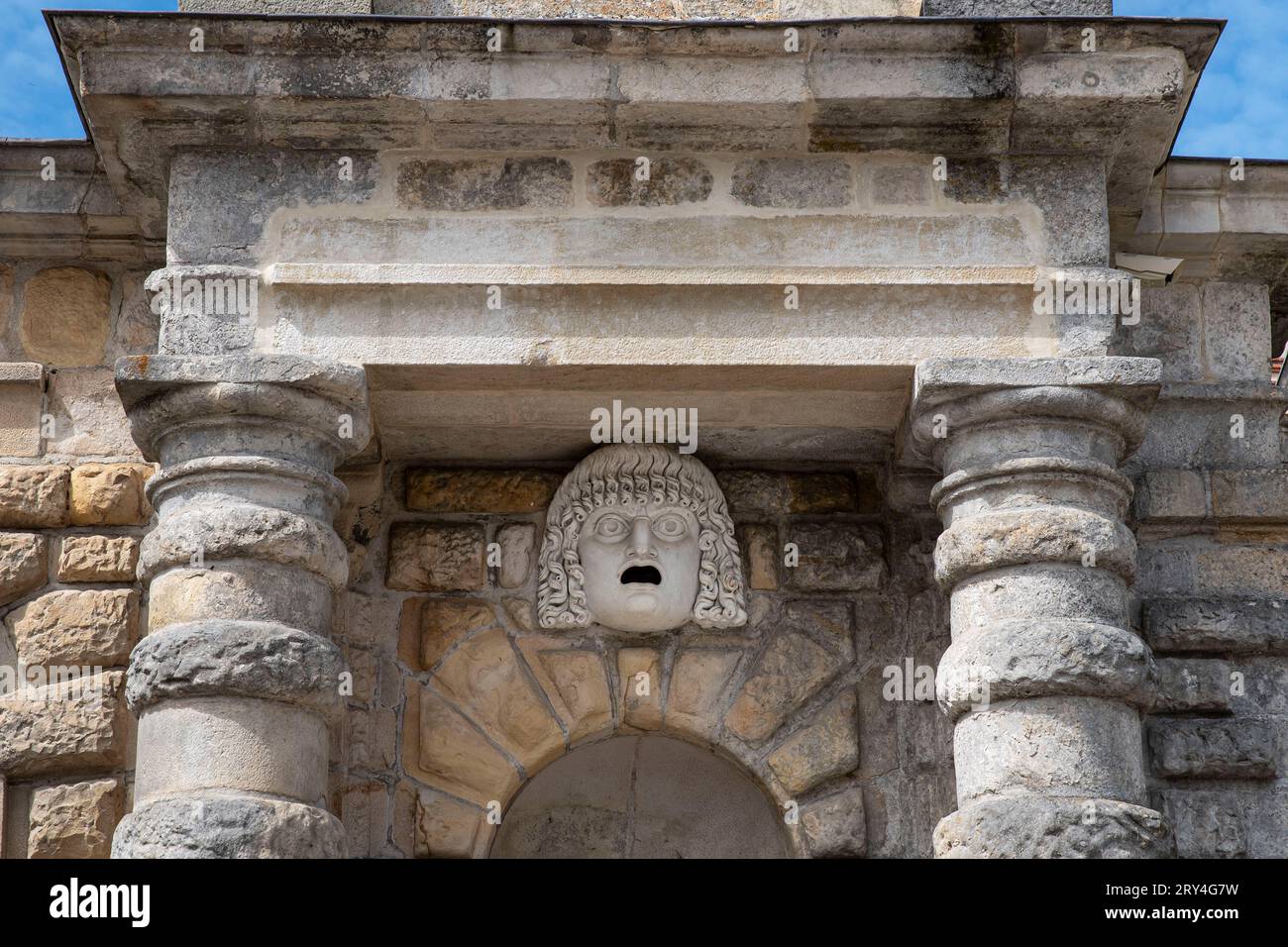 Sculpture of a face on an ancient white stone wall Stock Photo - Alamy