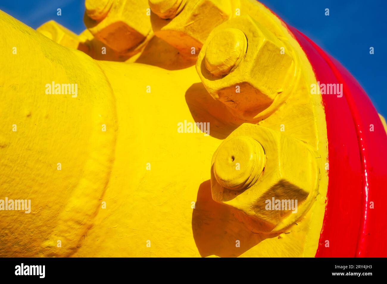 Metal pipe connection unit is painted with bright yellow and red paint ...