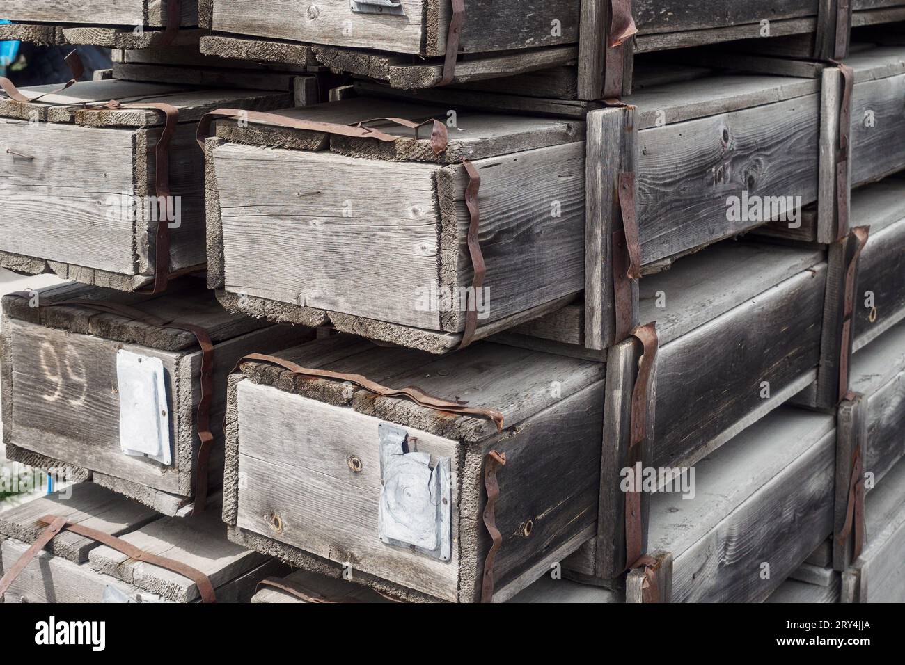Old wooden boxes with army weapons or shells. Supply or disposal of ...
