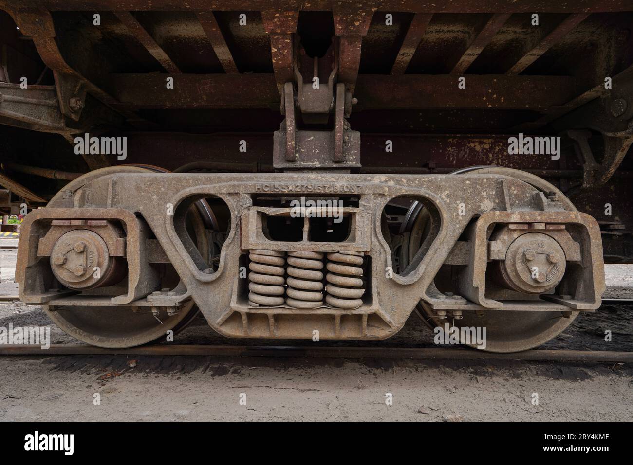 The oxidized and rusted freight carriage is at a railway station in ...