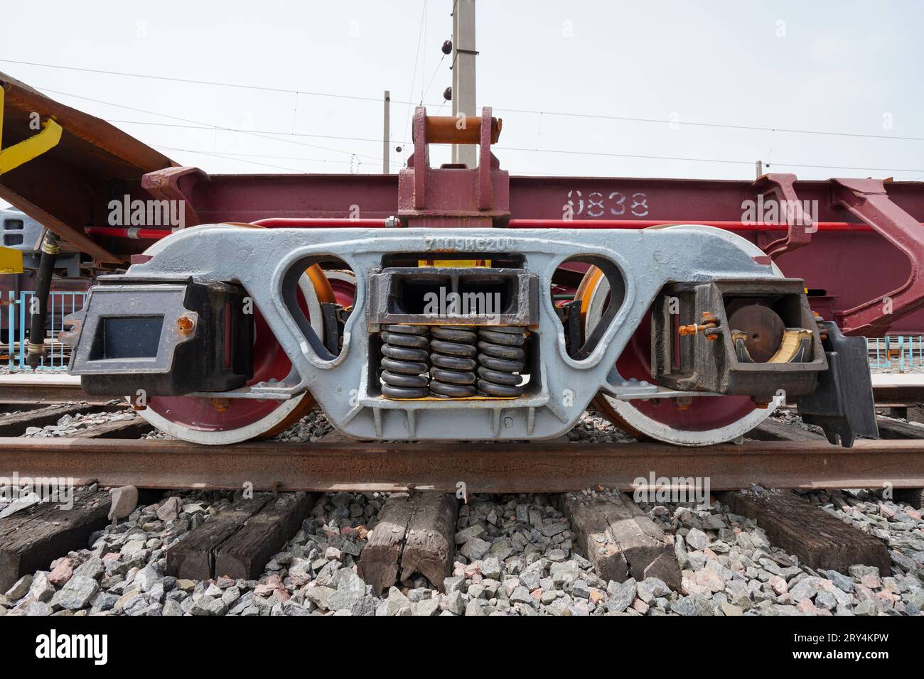 The oxidized and rusted freight carriage is at a railway station in ...