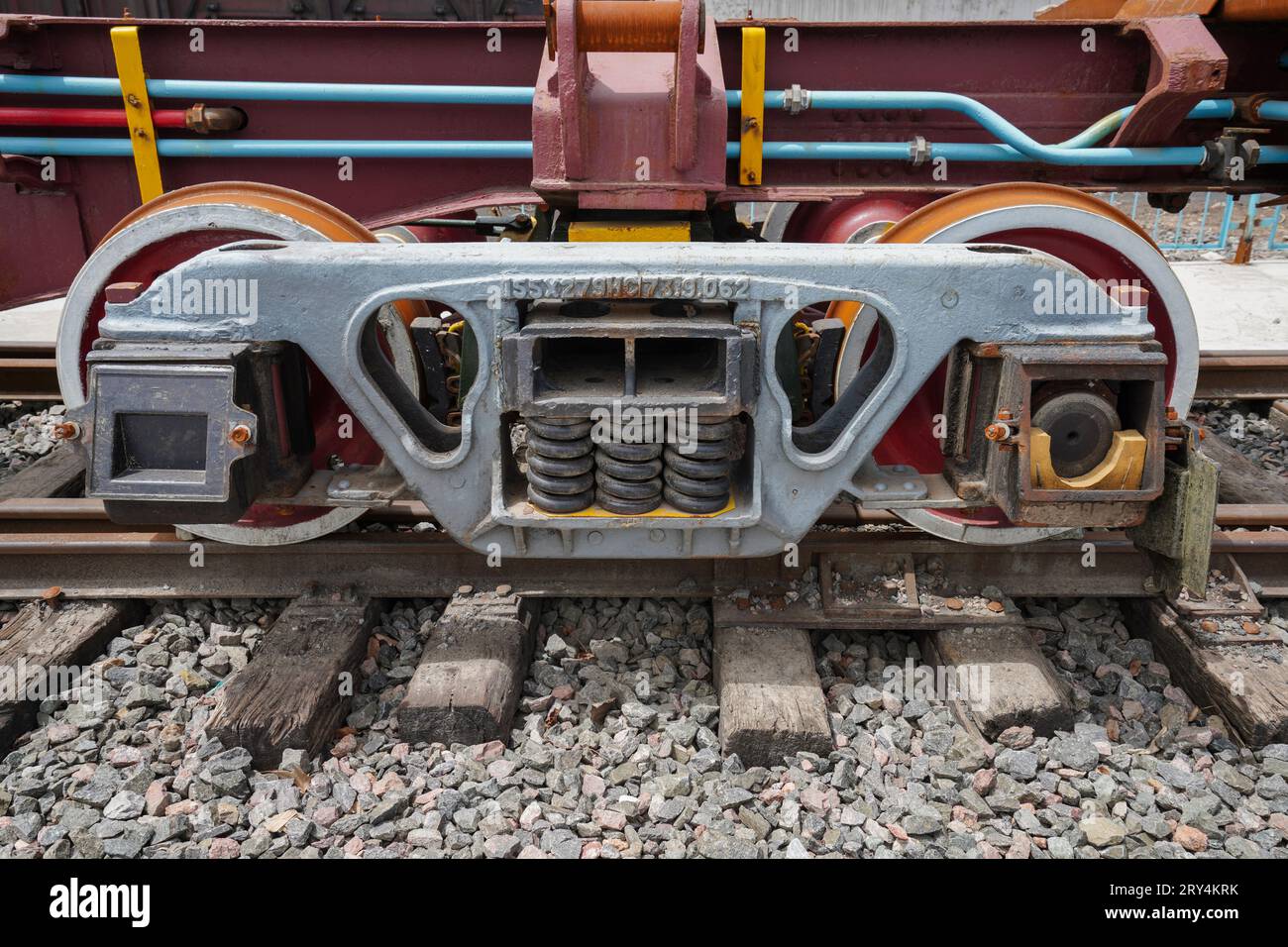 The oxidized and rusted freight carriage is at a railway station in ...