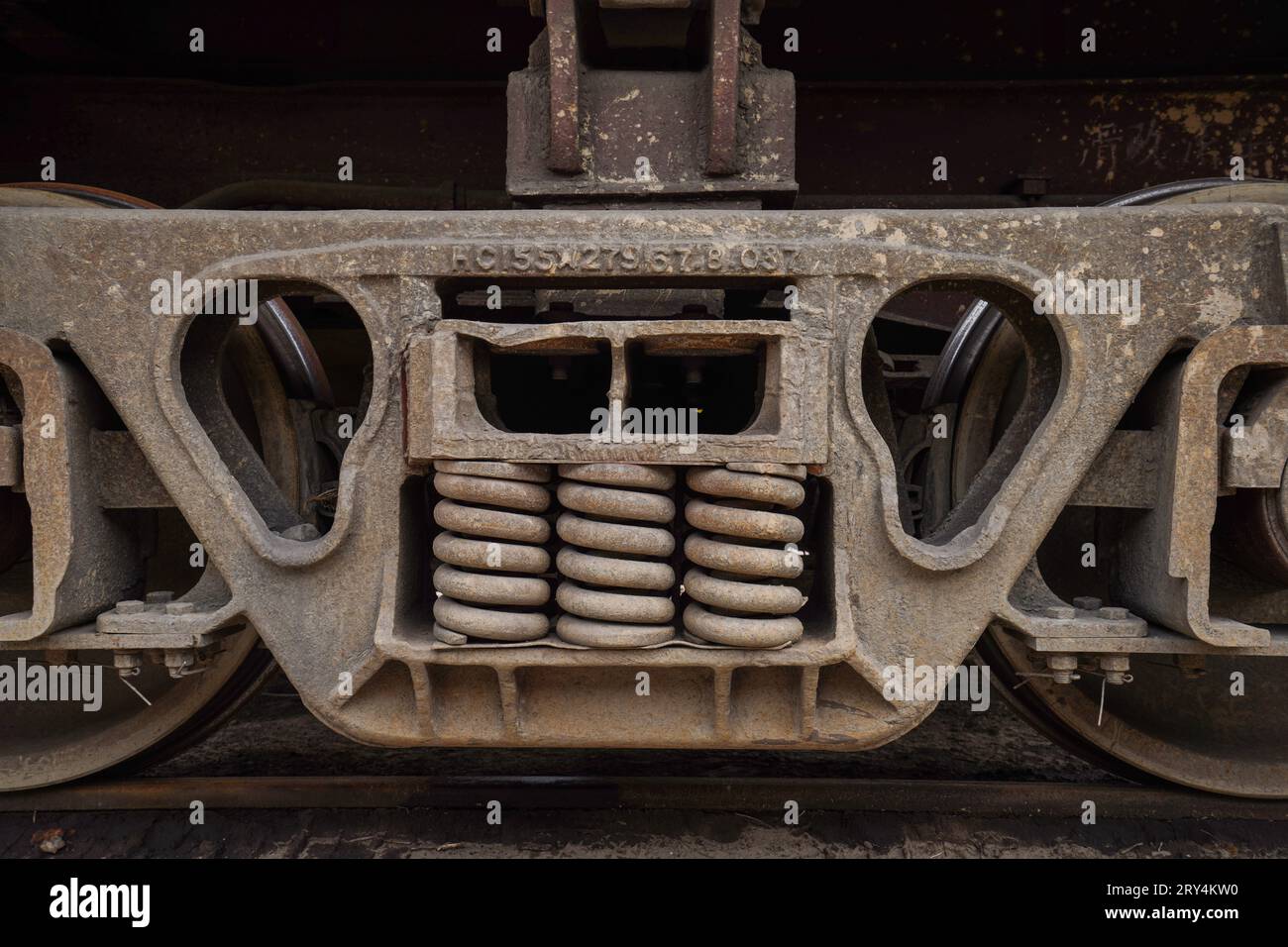 The oxidized and rusted freight carriage is at a railway station in ...