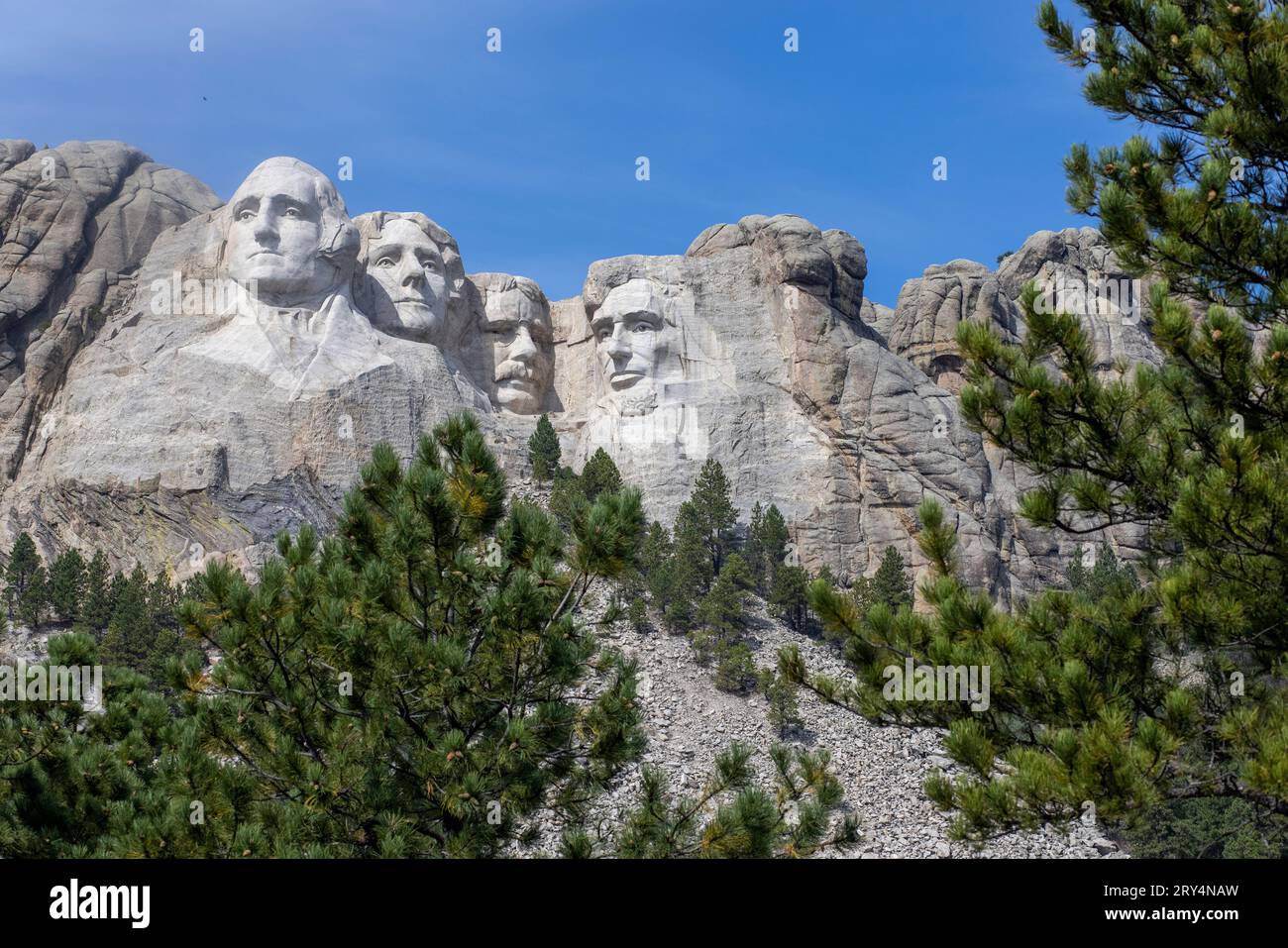 Mount Rushmore National Memorial is a colossal sculpture carved into ...