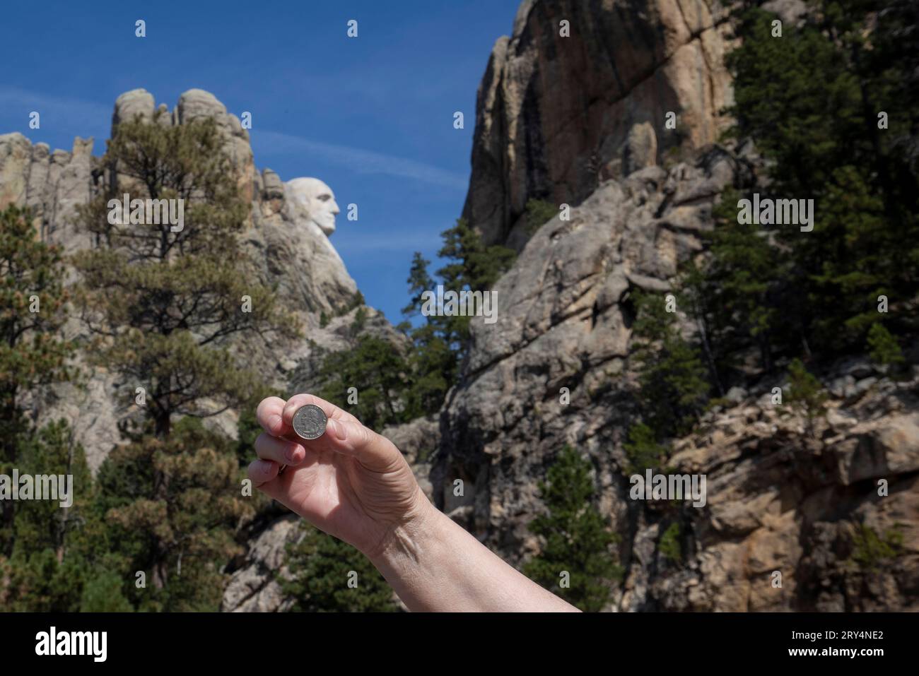 Mount Rushmore National Memorial is a colossal sculpture carved into the granite face of Mount ...