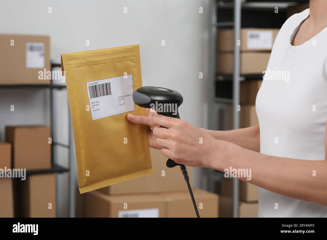 Woman scanner reading parcel hi-res stock photography and images - Alamy