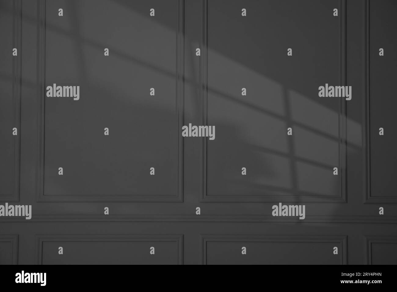 Shadow from window on dark grey wall indoors Stock Photo - Alamy