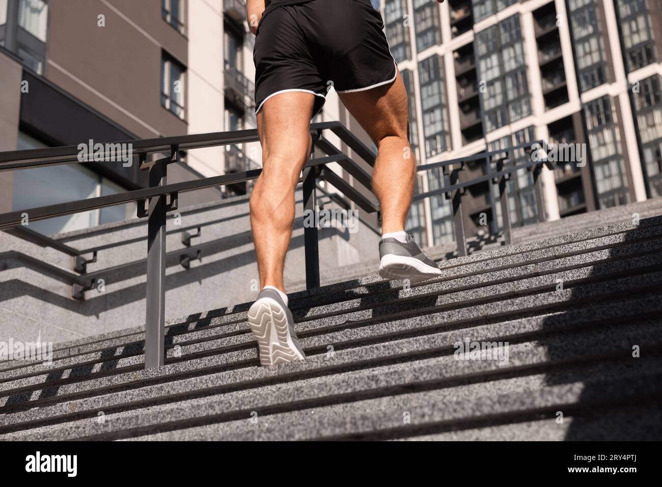 Man running up stairs hi-res stock photography and images - Alamy