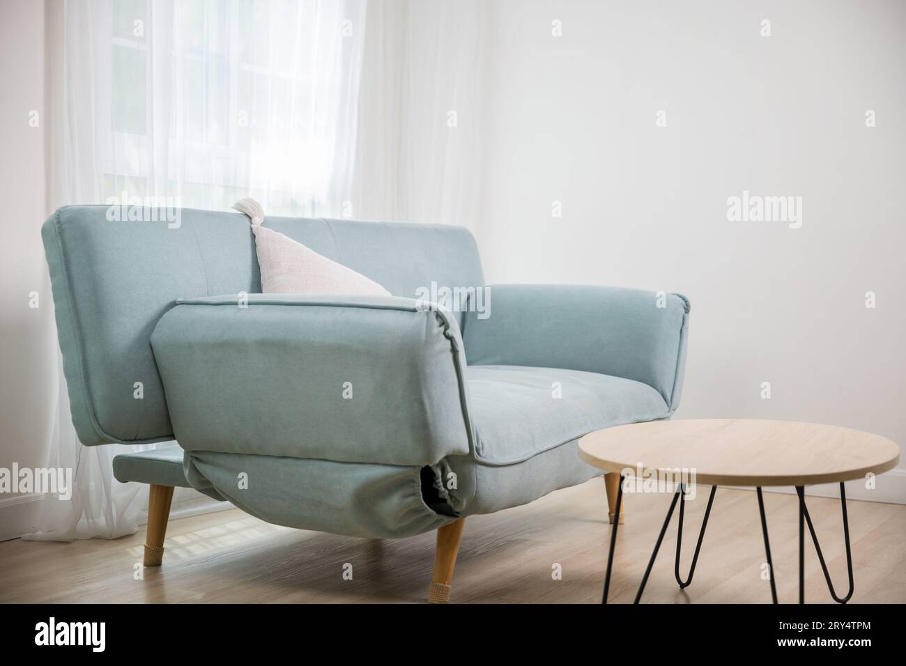 Sofa in living room with windows minimal style Stock Photo - Alamy