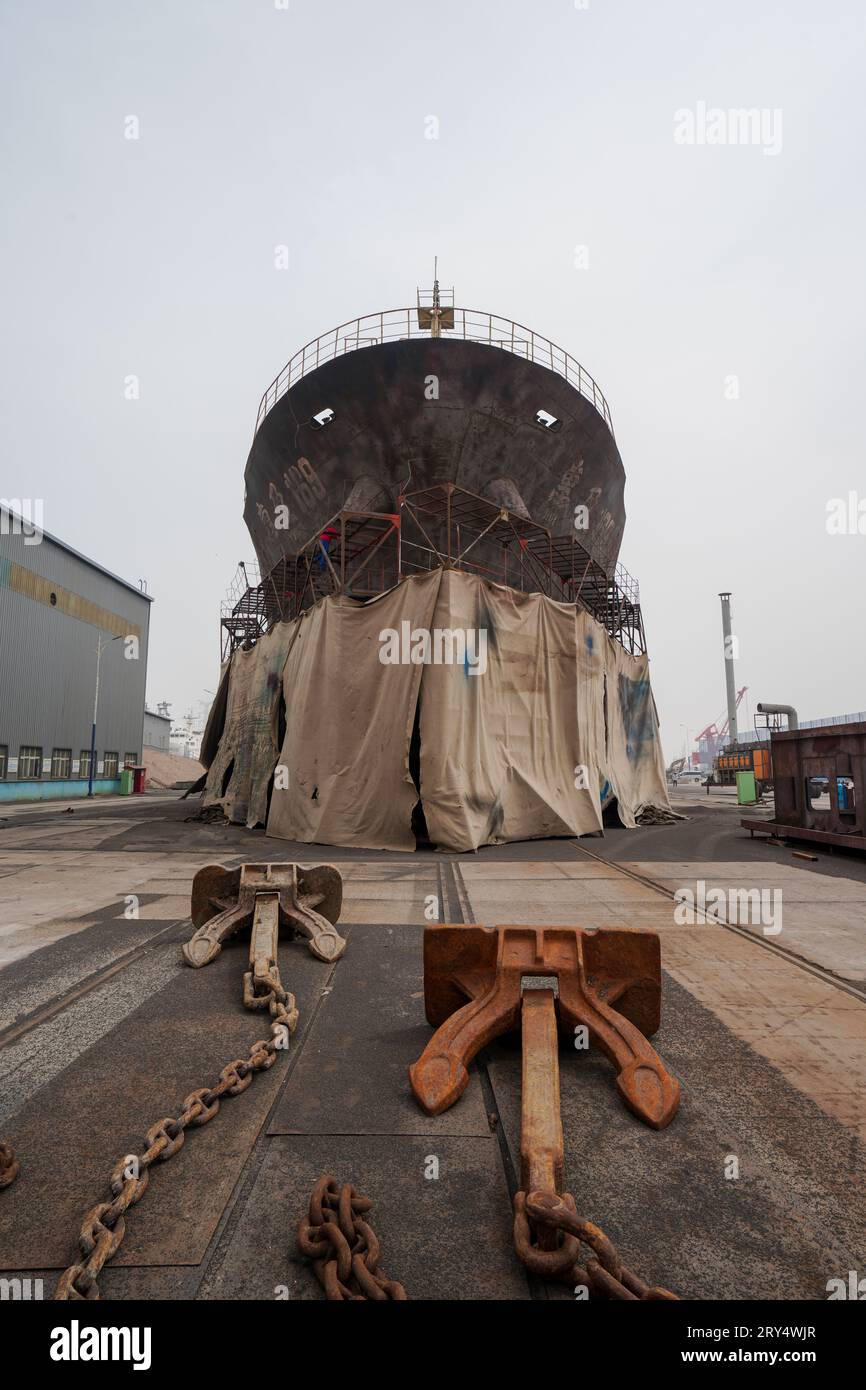 Ships and iron anchors under repair in shipyards Stock Photo - Alamy