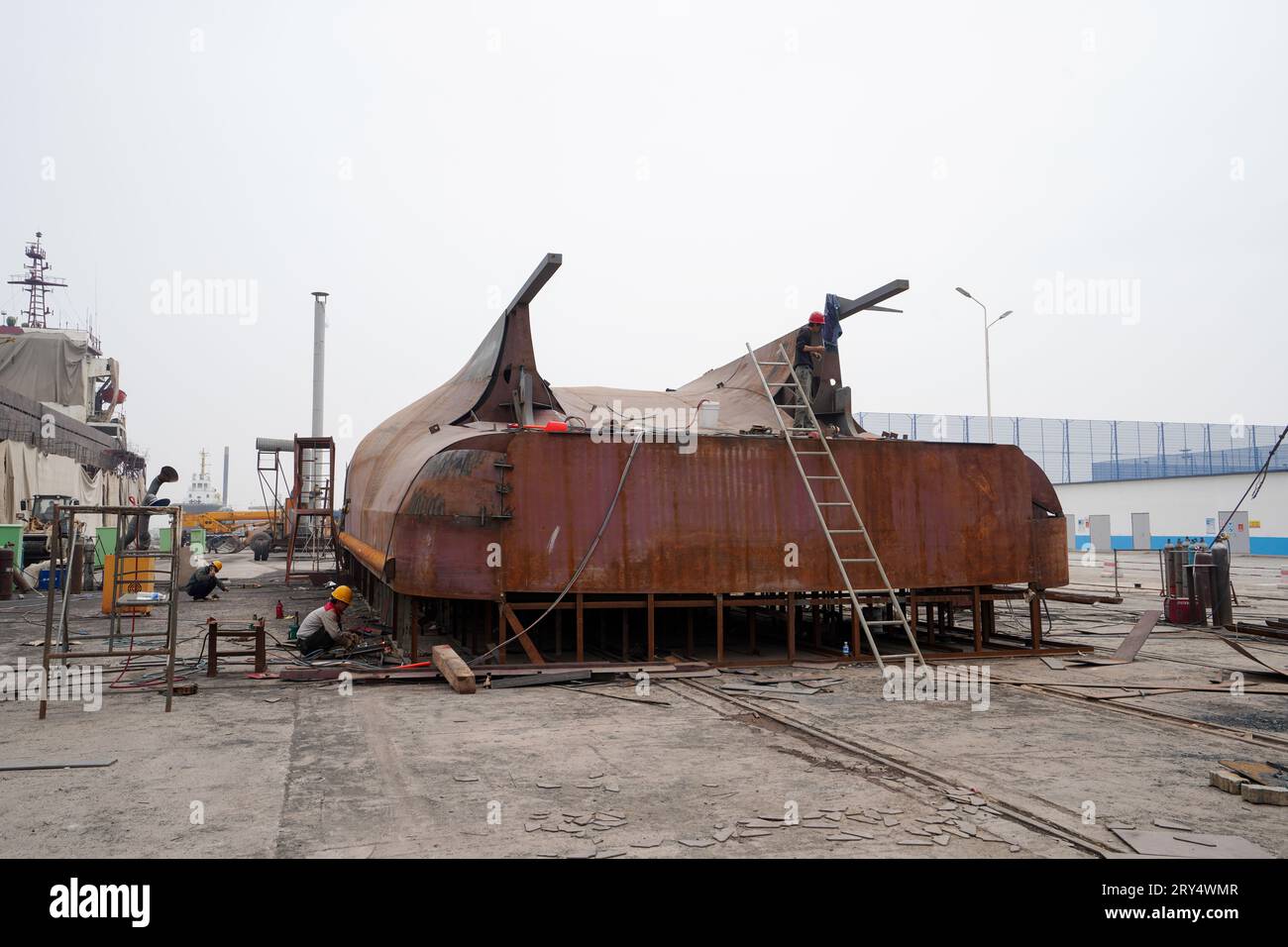 Luannan County, China - May 26, 2023: Workers welding hull steel plates ...